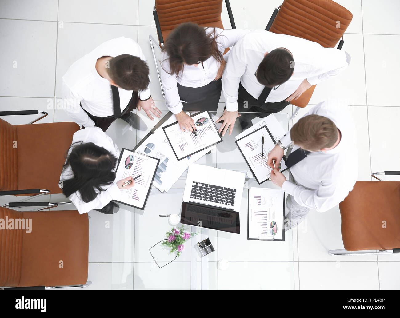 top view. business team standing near the desktop.the concept of ...