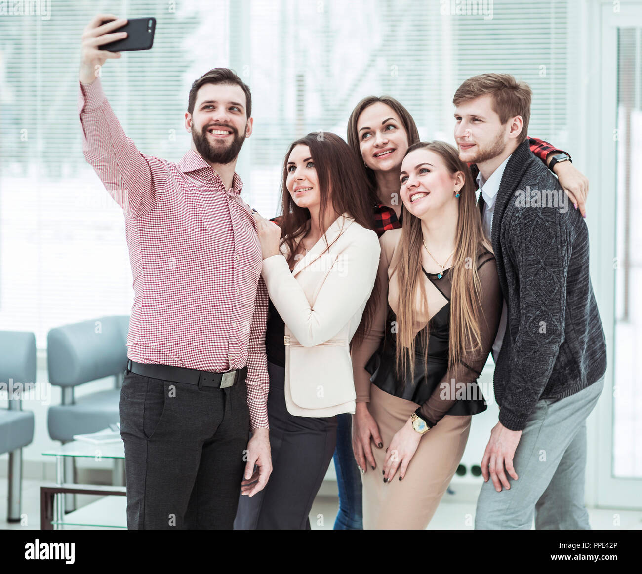 professional business team making selfie while standing near window in ...