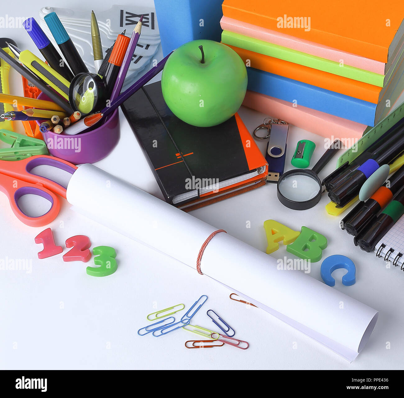 close up.a sheet of drawing paper and school supplies isolated on white ...