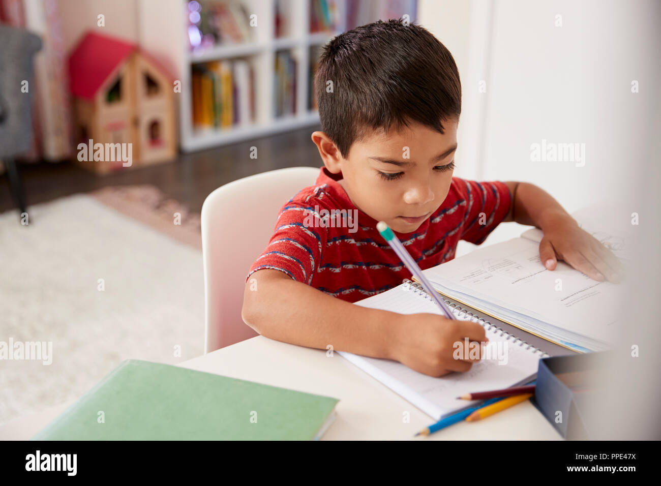 Boy studying desk hi-res stock photography and images - Alamy