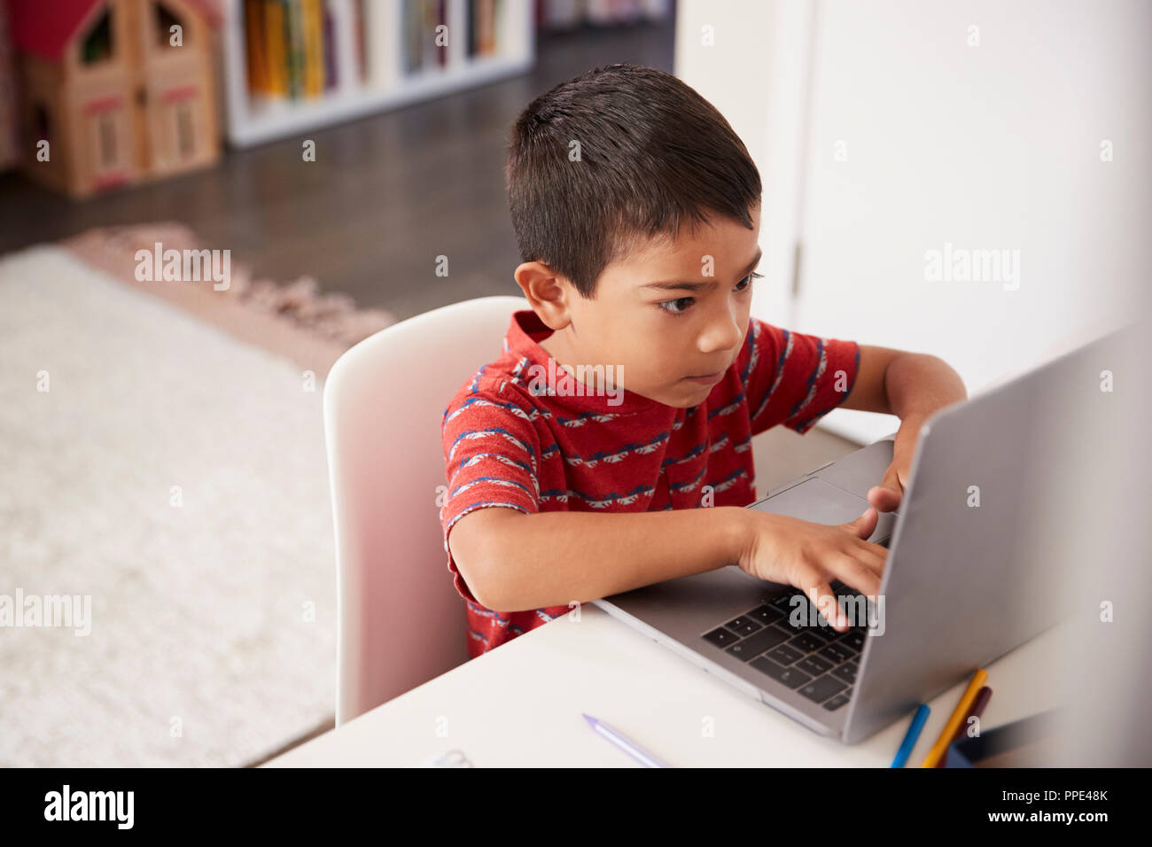 Child working at computer hi-res stock photography and images - Alamy