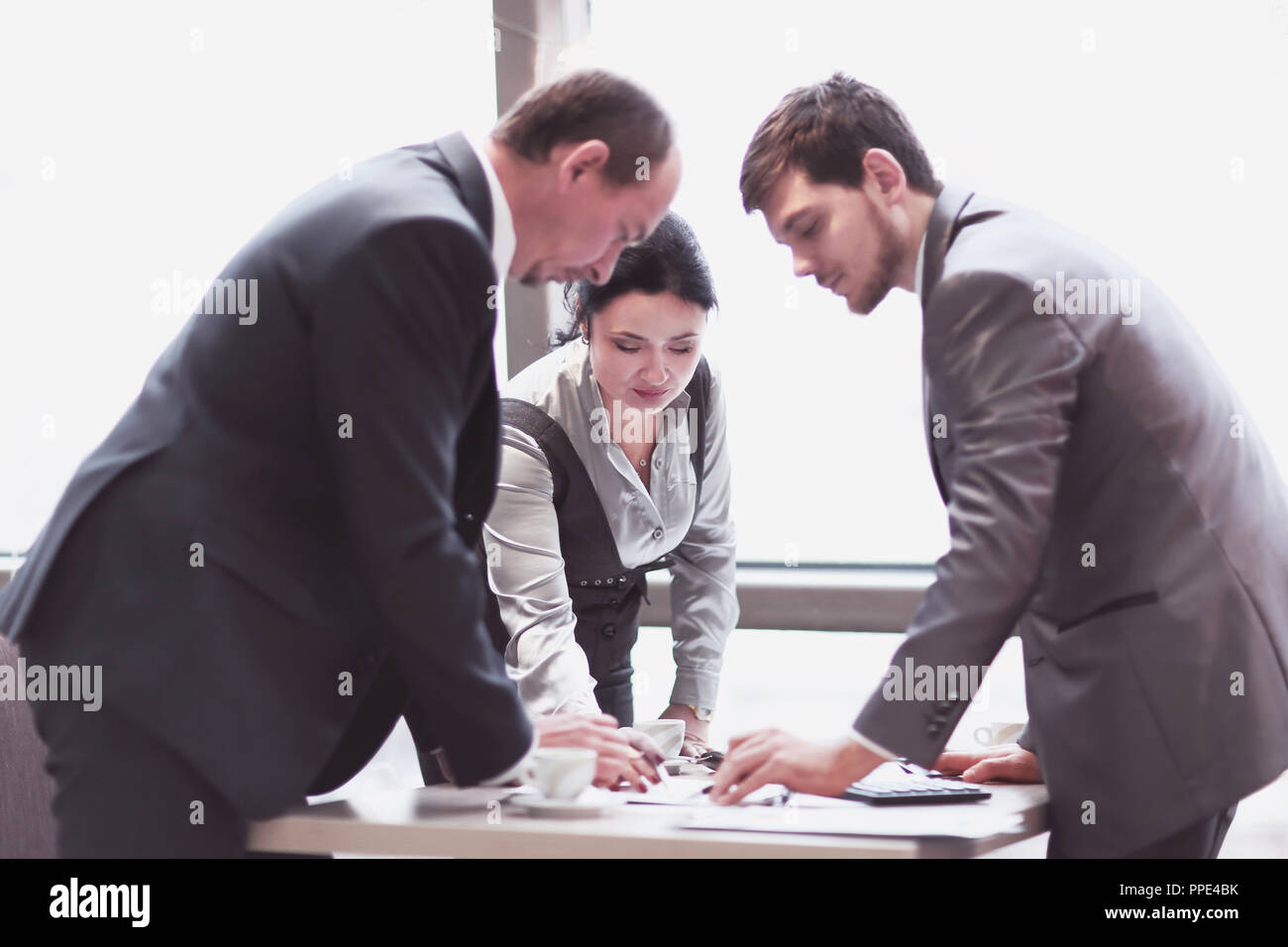 Group employees discussing something hi-res stock photography and ...