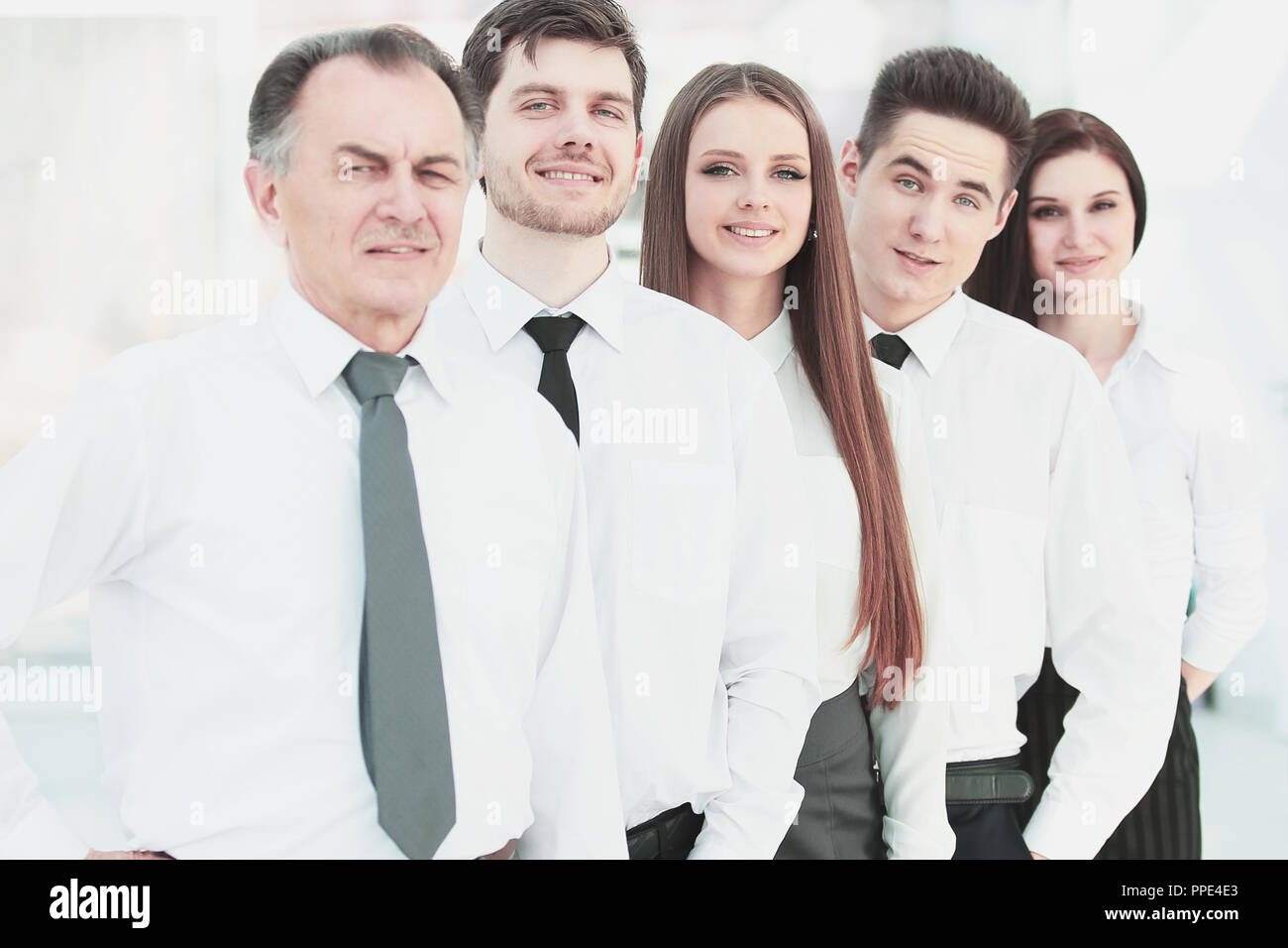 group of young business people standing in a row Stock Photo - Alamy
