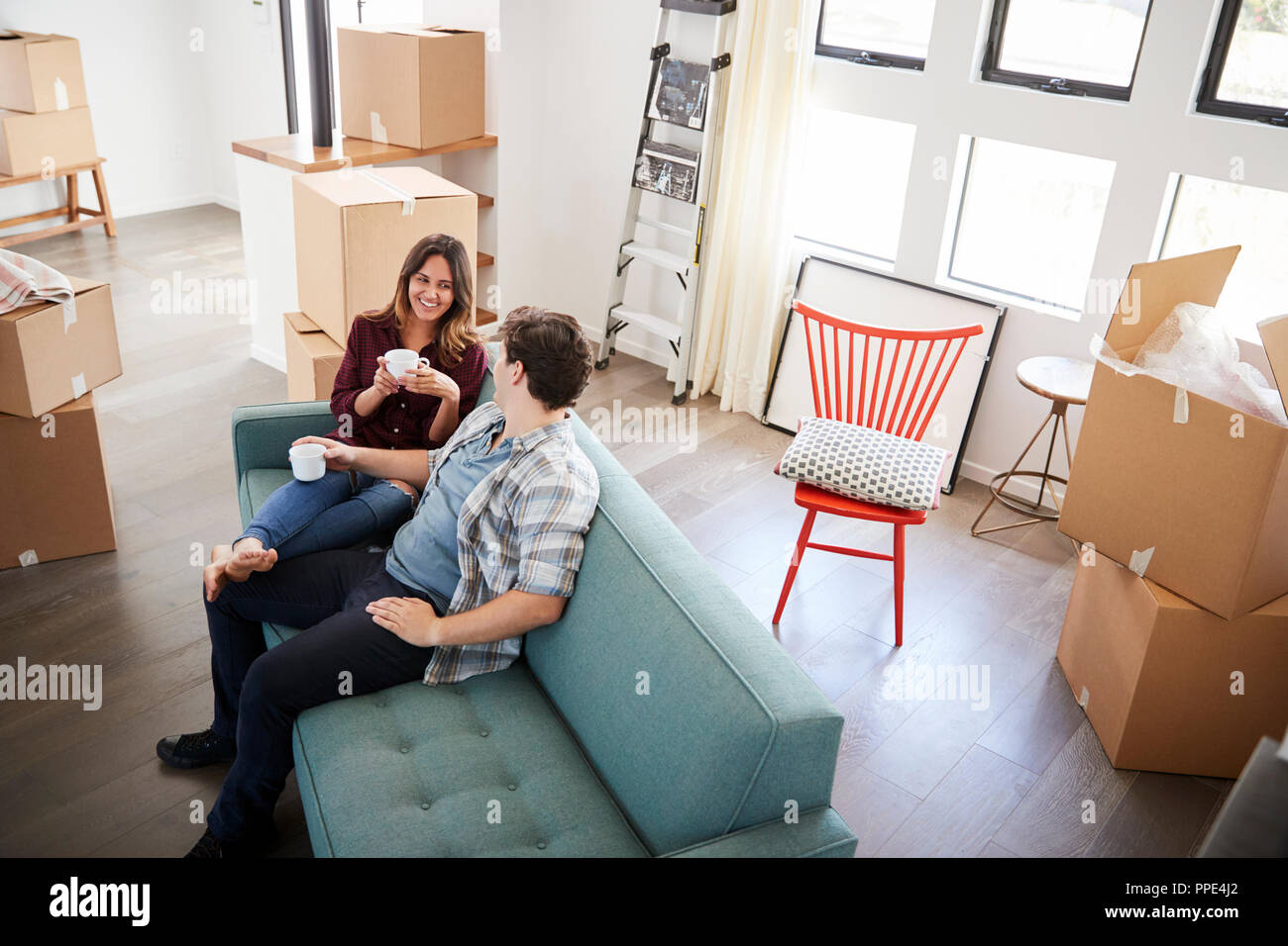 Person surrounded by boxes hi-res stock photography and images - Alamy