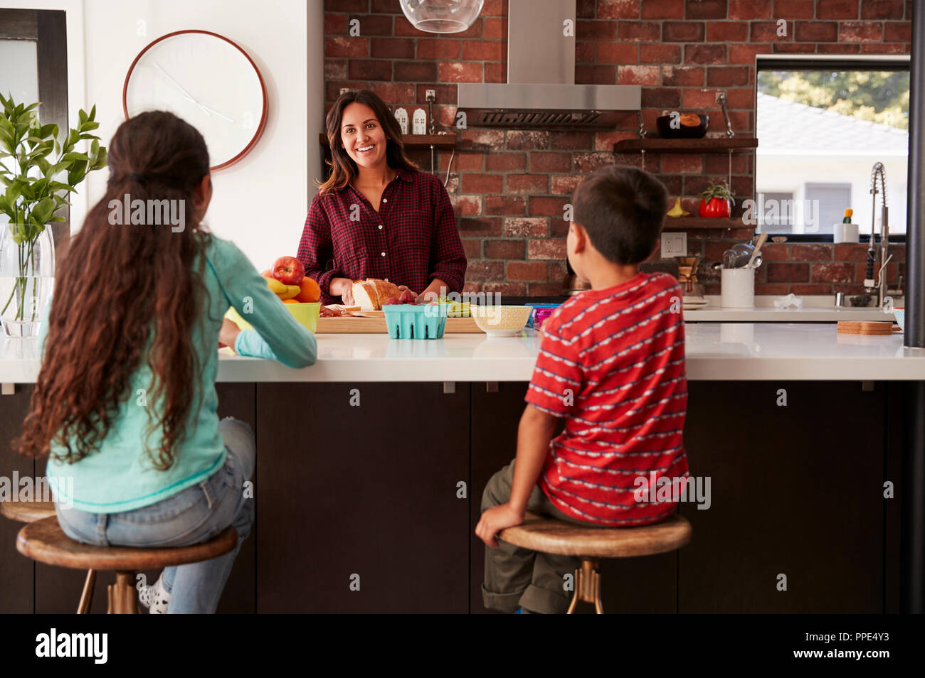 Mother Making School Lunches For Children In Kitchen At Home Stock ...