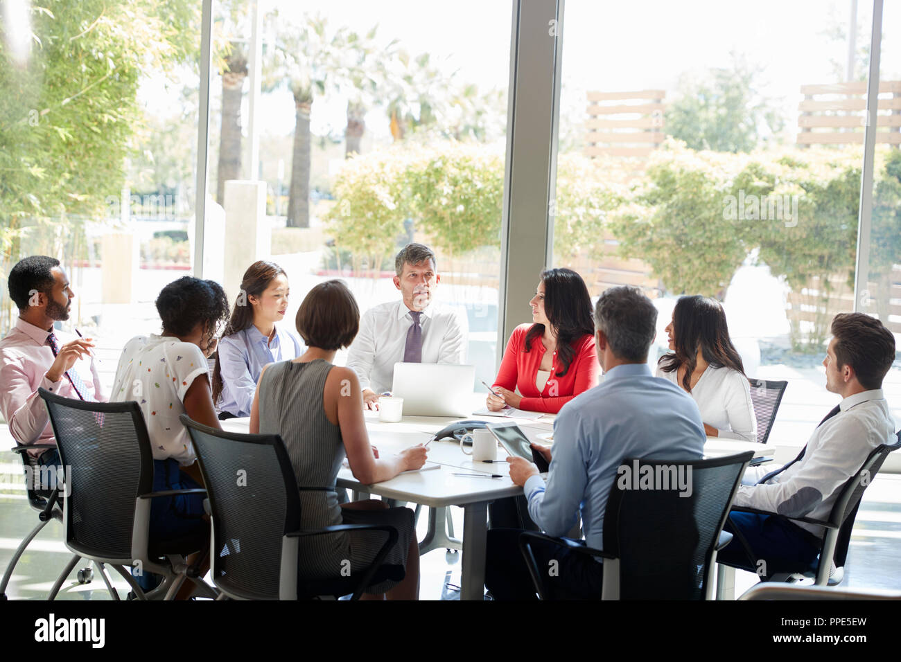 Corporate business team in discussion in a meeting room Stock Photo - Alamy