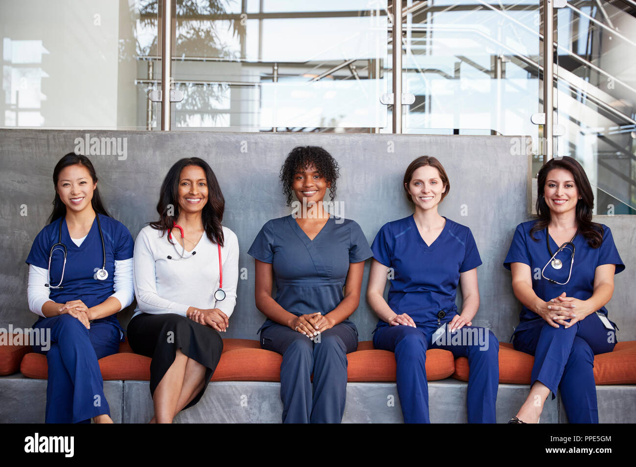 Female healthcare workers sitting together in a hospital Stock Photo ...