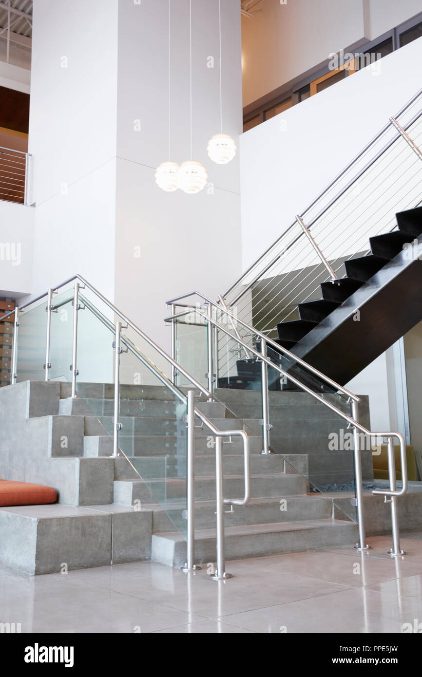 Atrium lobby and stairs in modern office building, vertical Stock Photo ...