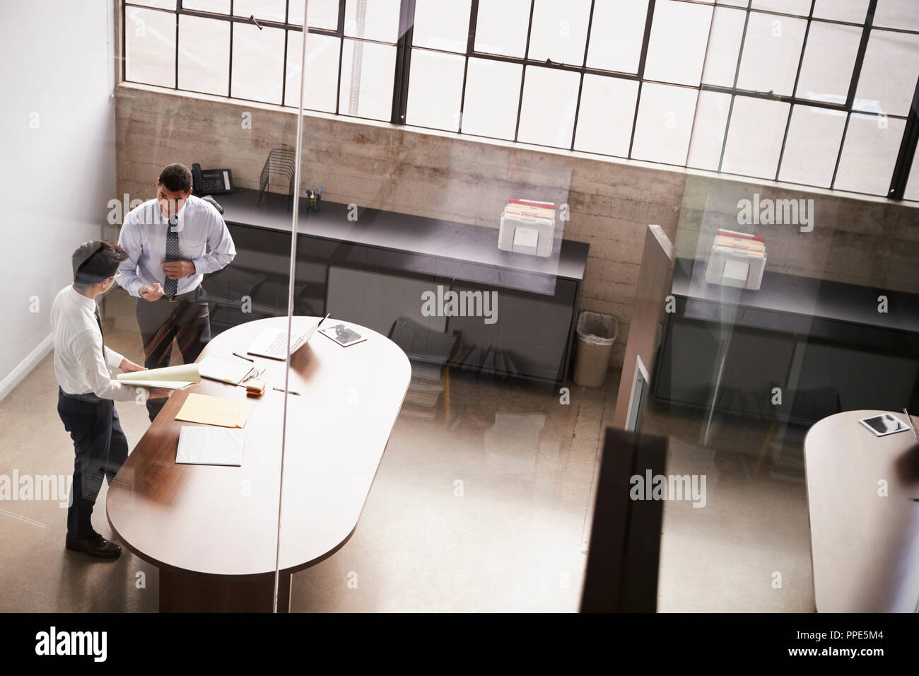 Two colleagues talking desk office hi-res stock photography and images ...