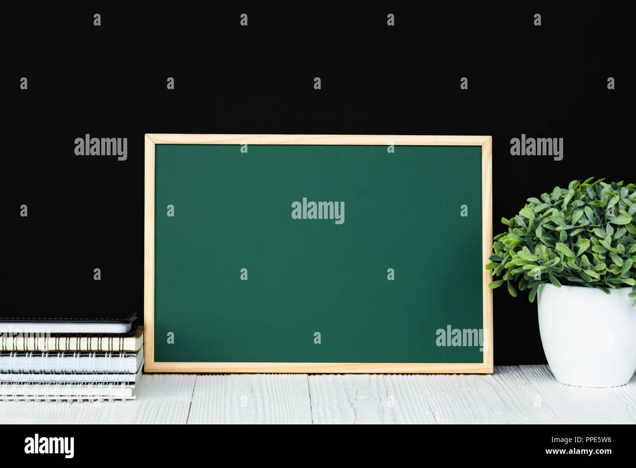 Back to school and education concept idea, green chalkboard with pile ...