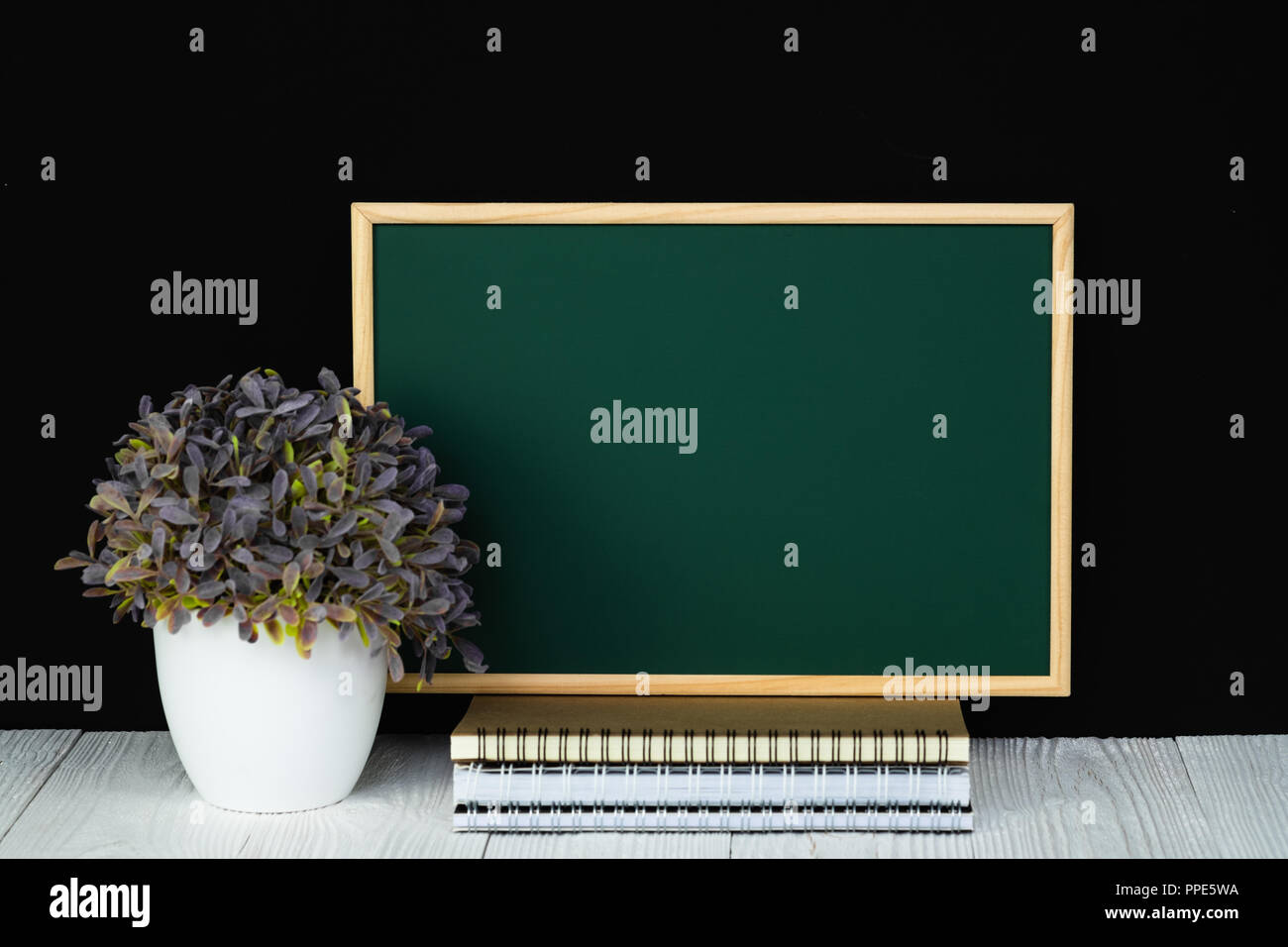 Back to school and education concept idea, green chalkboard with pile ...
