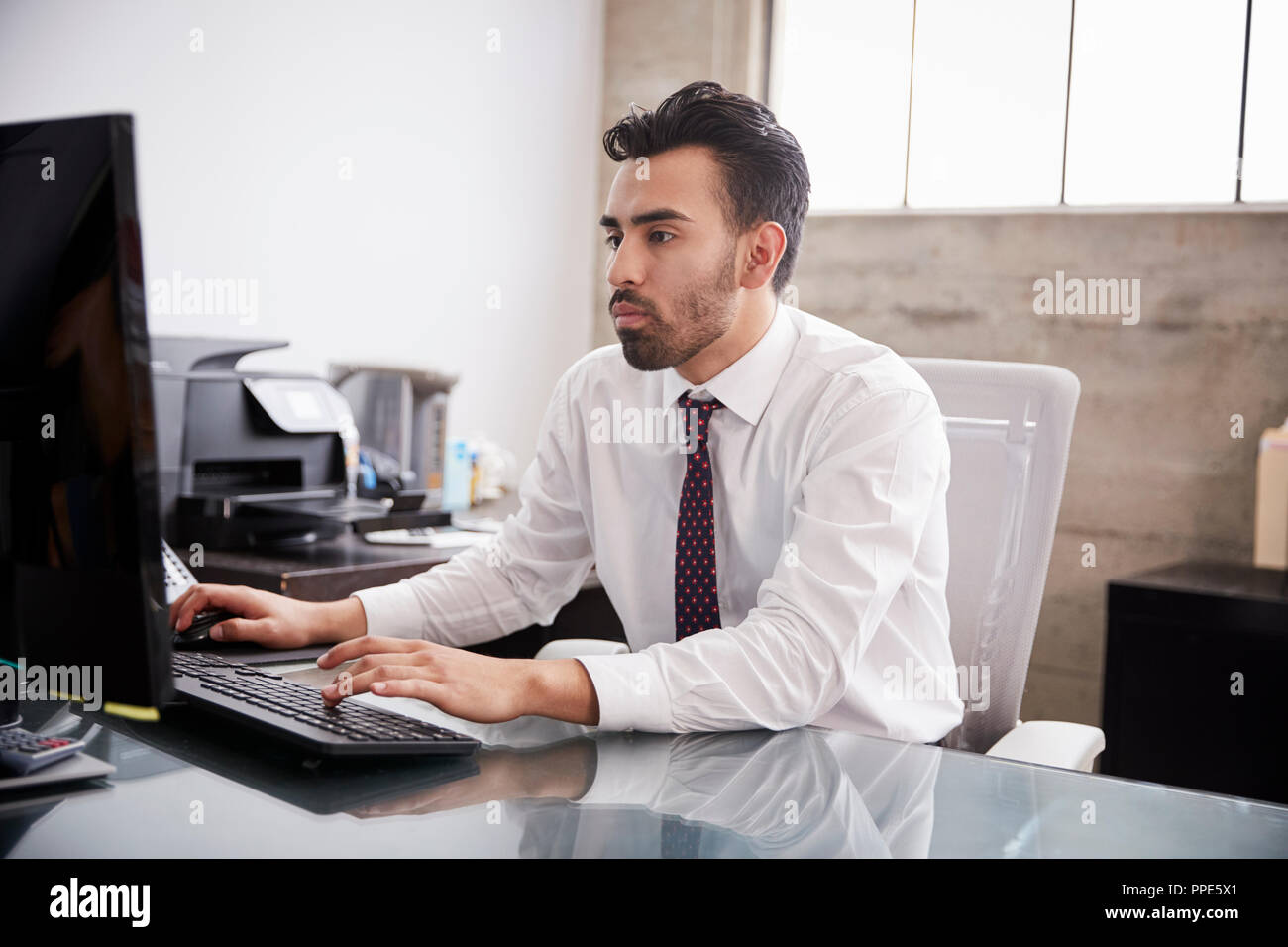 Serious hispanic man using hi-res stock photography and images - Alamy