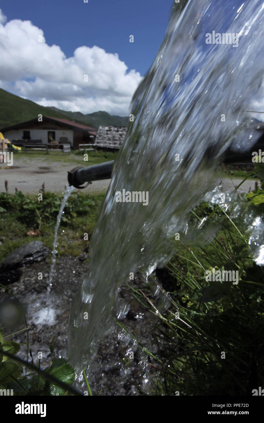Spring water from a well in the mountains hi-res stock photography and ...