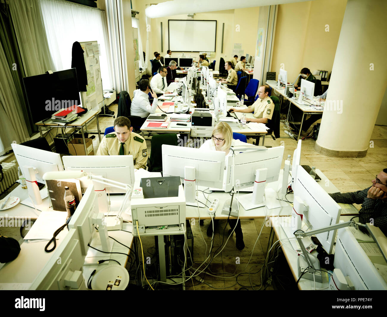 Police officers in the situation room of the ?Coordinating Staff Asylum ...