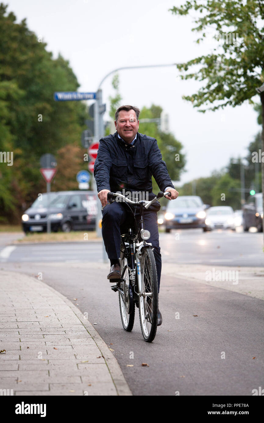 Deputy mayor Josef Schmid rides on bicycle from his residence in Allach ...