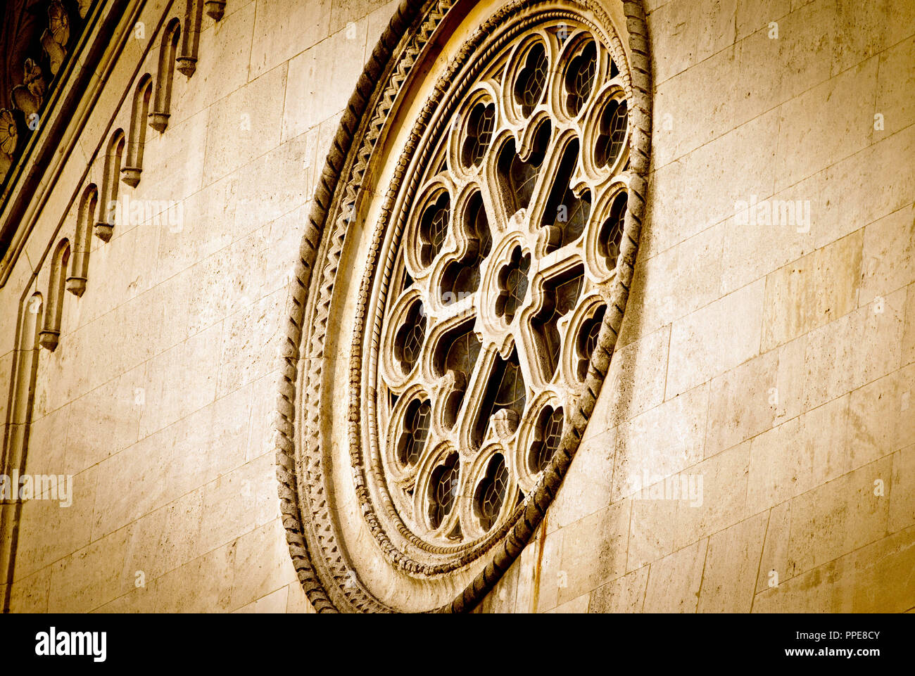 A rose window on the facade of the Ludwigskirche (Catholic Parish and ...