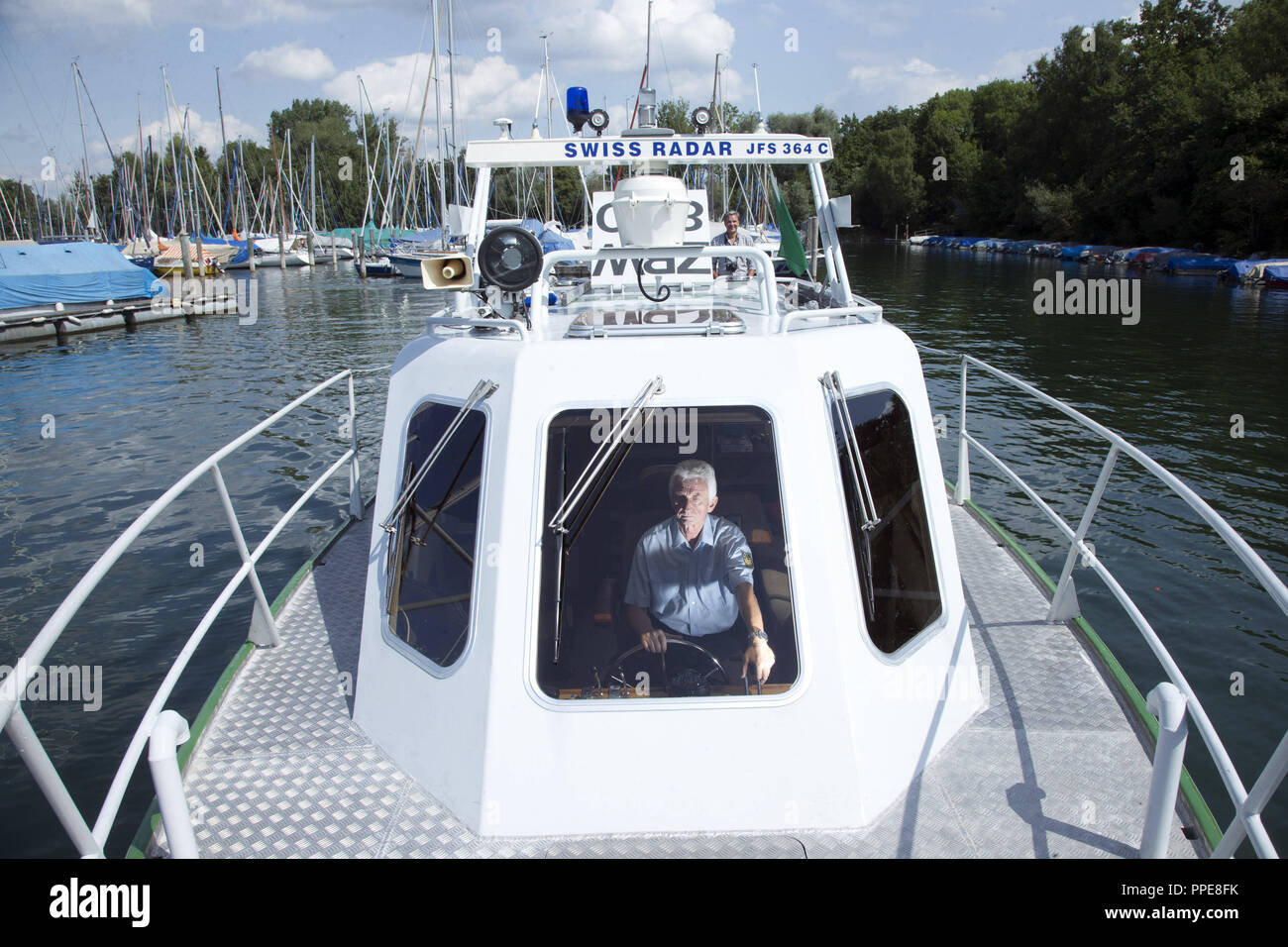 Customs boat on Lake Constance. At the wheel Wolfgang Simonsen Stock ...