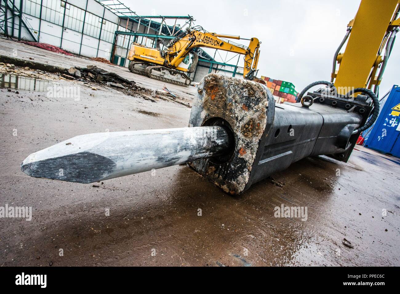 Pictured from the ground: a brand new hydraulic hammer on a Caterpillar ...