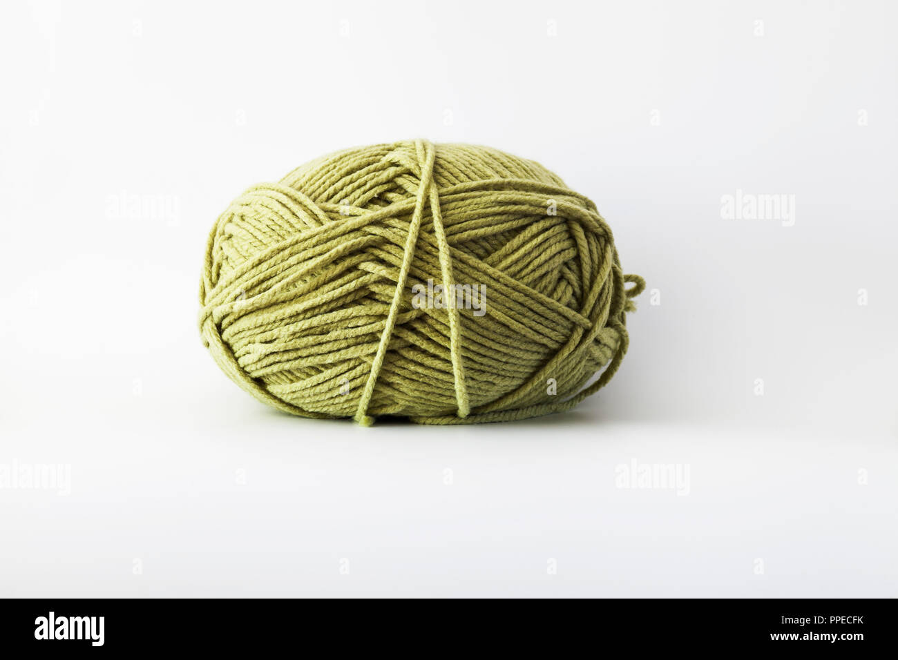 A ball of green knitting wool Stock Photo - Alamy