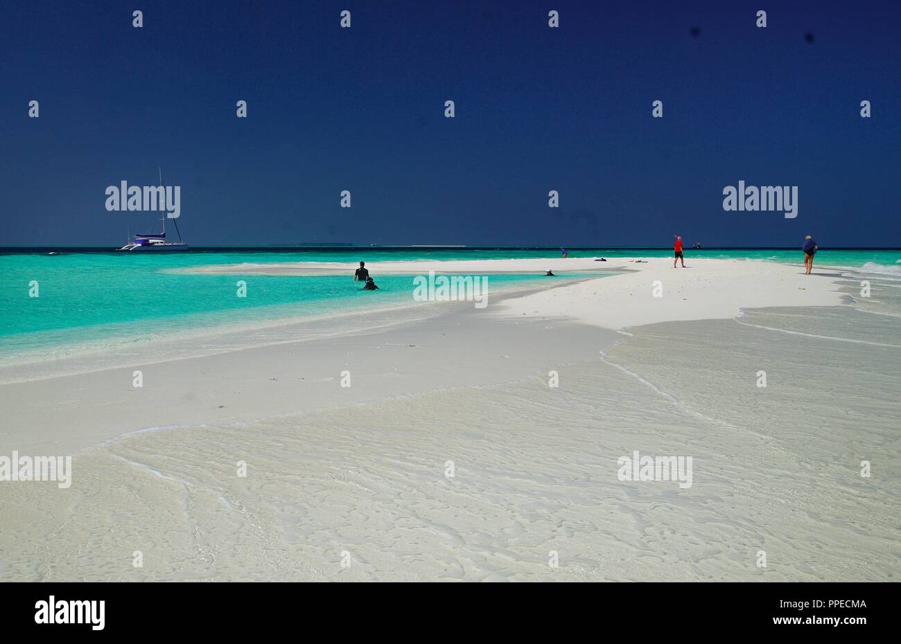 Vacationers enjoy the illusion of a paradise on a small sandbar in the ...