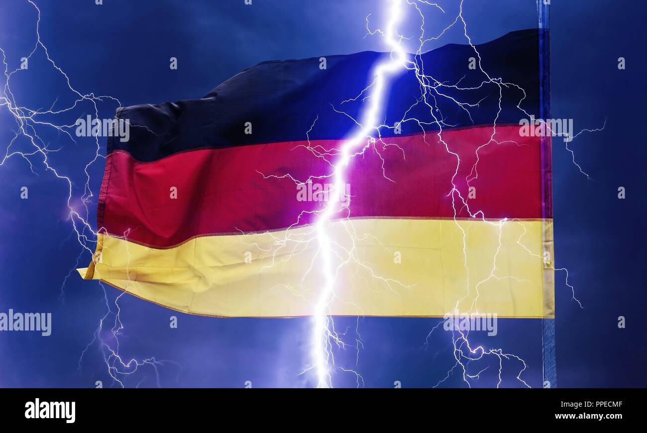 A flash of lightning seems to split an German flag into two parts ...