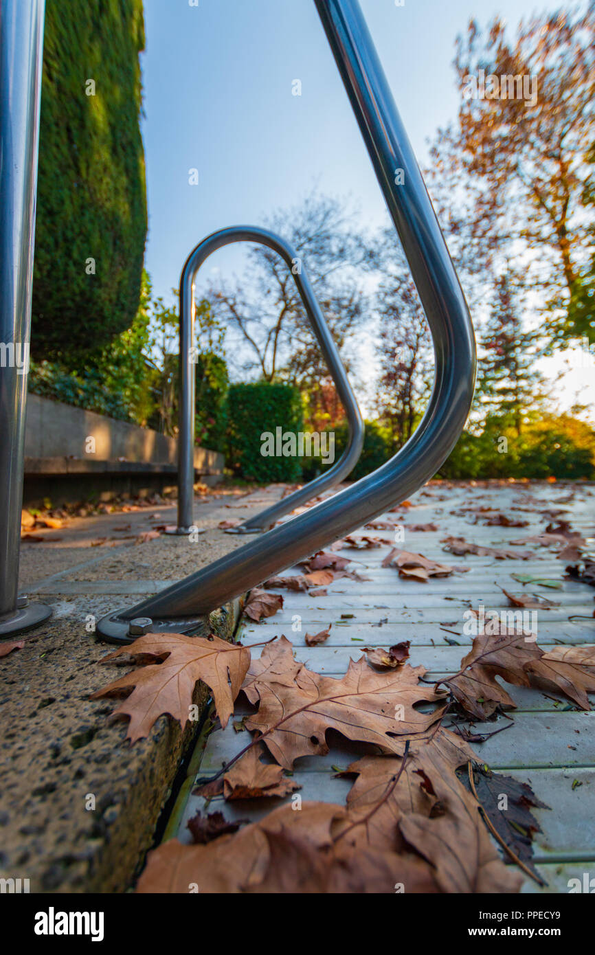 Closes swimming pool with coloful leaves on the cover in autumn ...