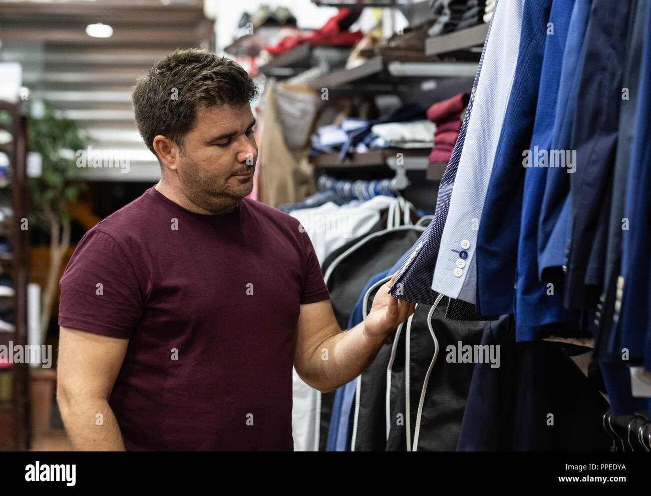 Woman try clothes man hi-res stock photography and images - Alamy