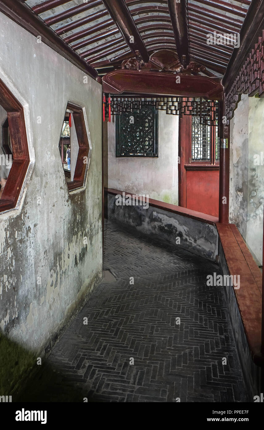 Narrow alley with antique brick walls, building style in the Chinese ...
