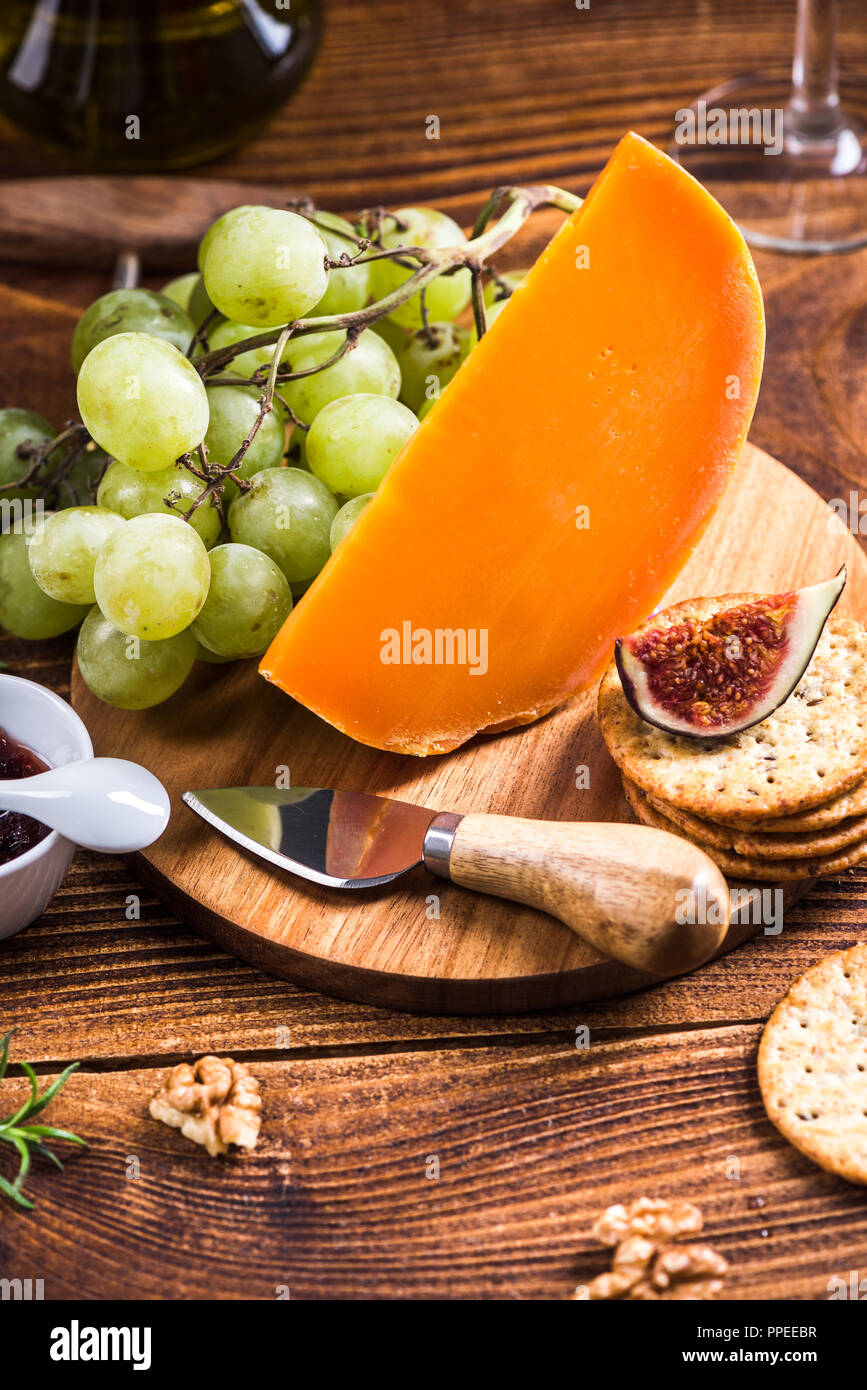 Serving American Cheddar cheese Stock Photo - Alamy