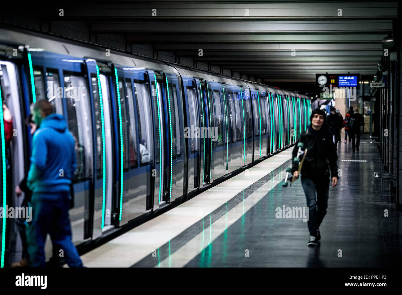 New U-Bahn train of the C2 with lit doors in the subway station Alte ...