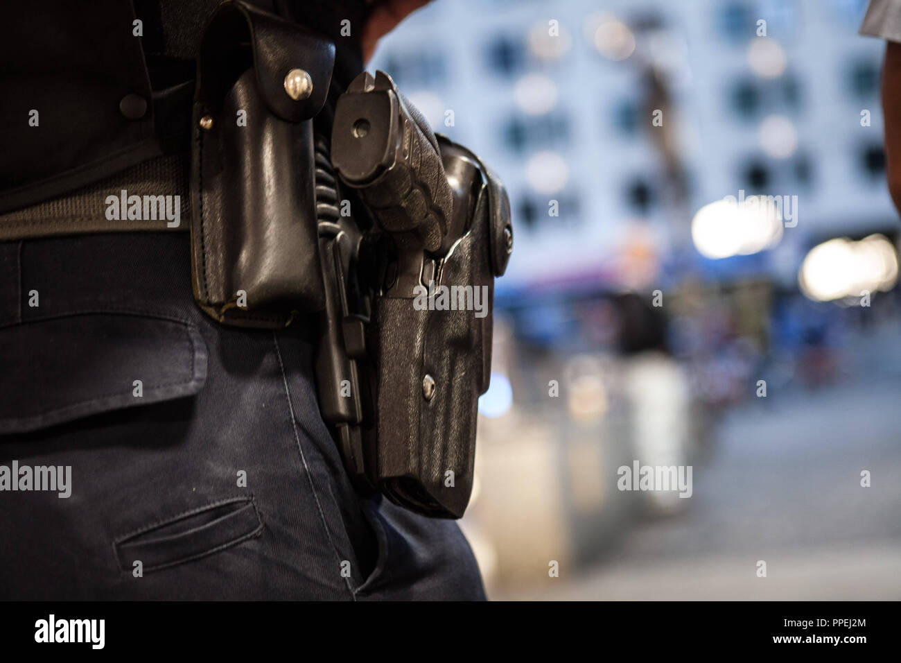 Police officers look out and surveil at the main station in Munich ...