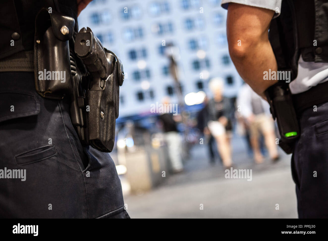 Police officers look out and surveil at the main station in Munich ...