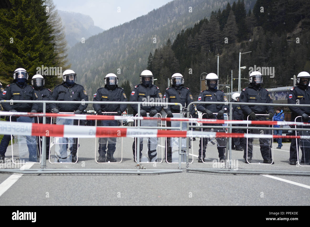 Austrian police officers standing at the border crossing to Austria at ...