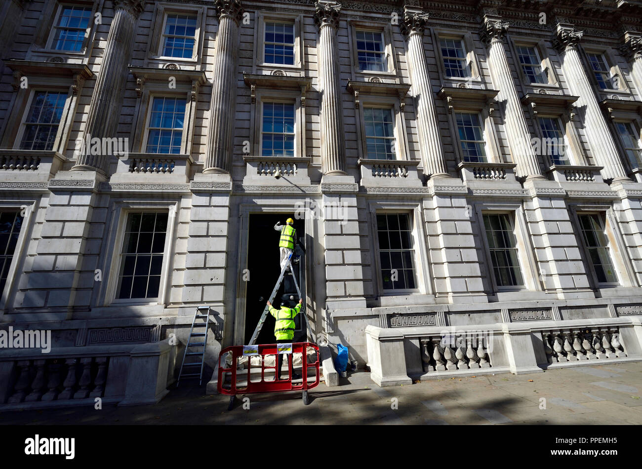 Workers working on building facade hi-res stock photography and images ...