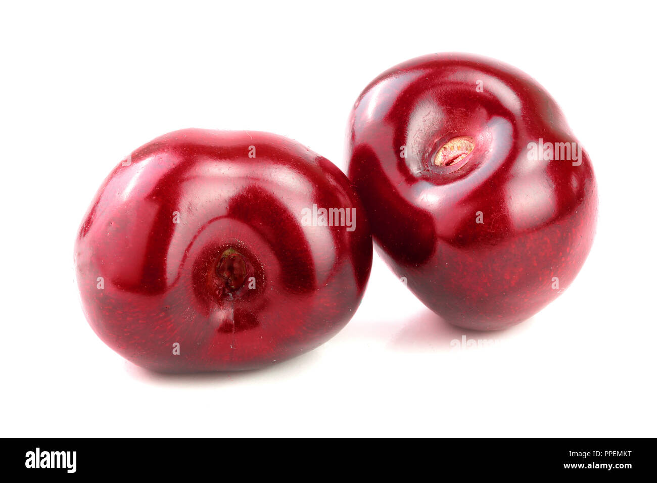 Sweet red cherries isolated on white background macro Stock Photo - Alamy