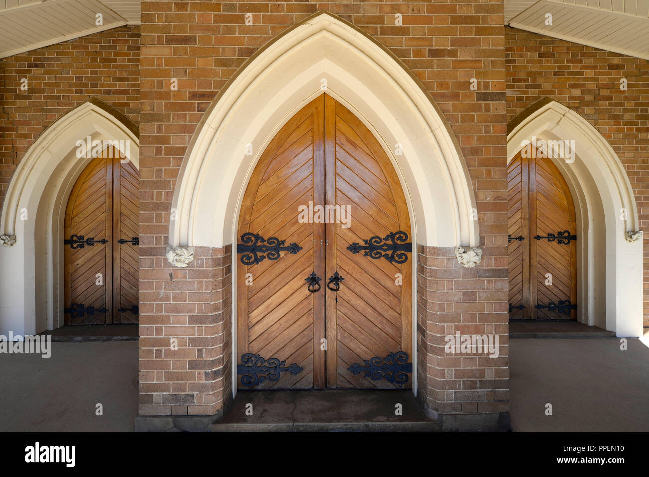 uniting church, inverell, trinity of gothic arched entrance doors Stock ...