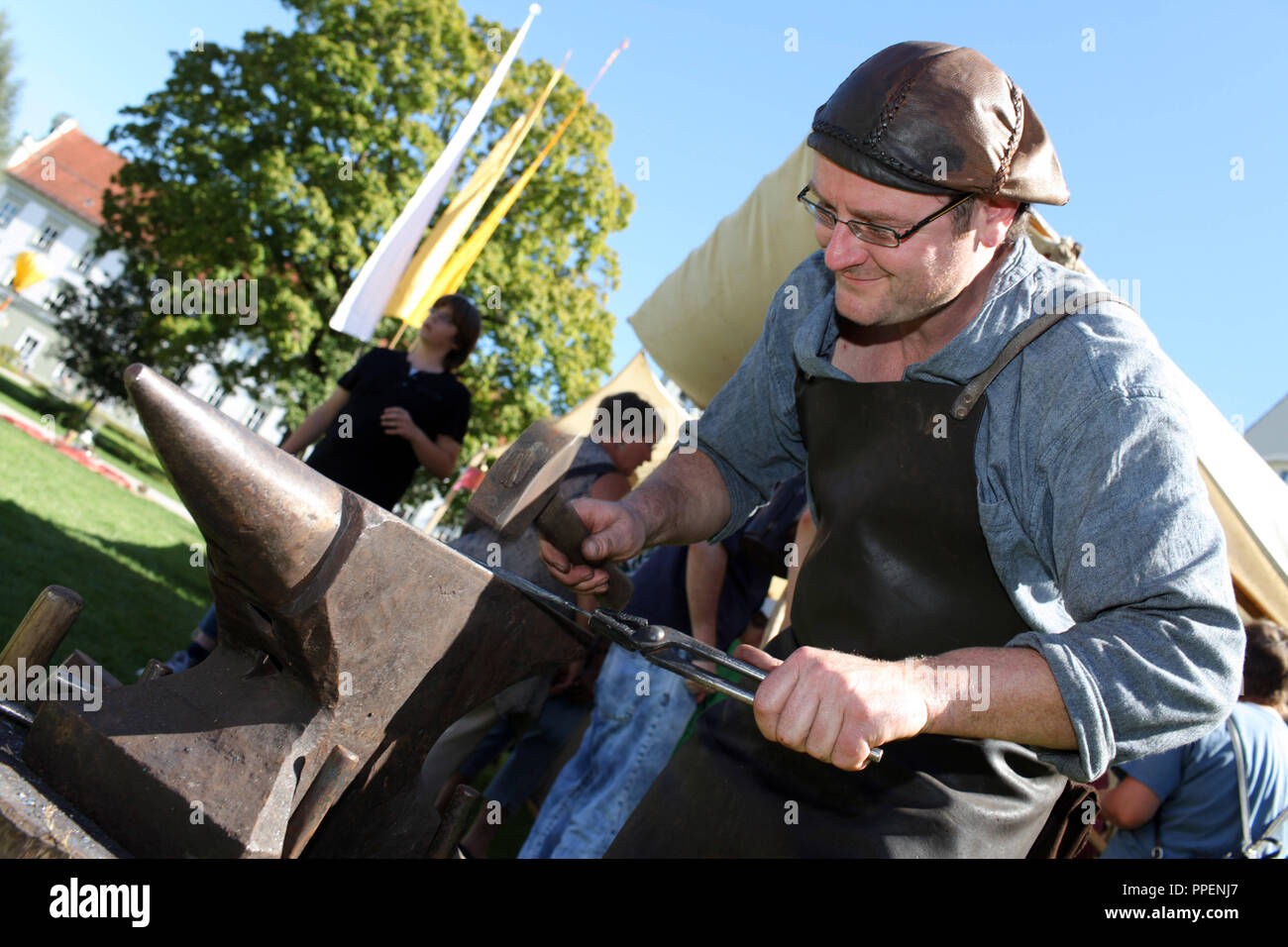 Blacksmith at work at the medieval market on the Klosterwiese ...