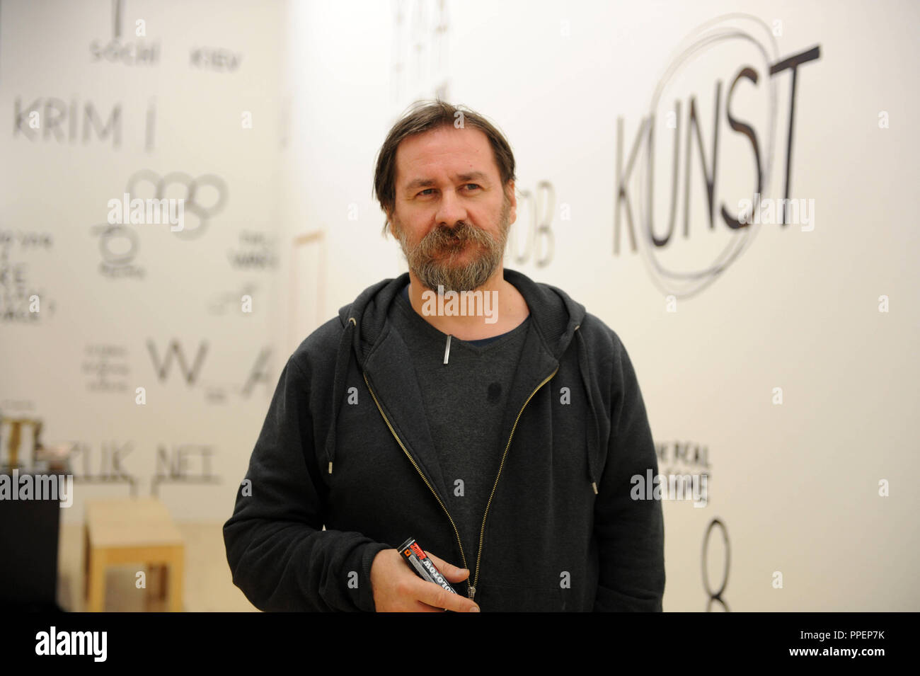 Artist Dan Perjovschi paints his wall for the exhibition 'Playtime' in ...
