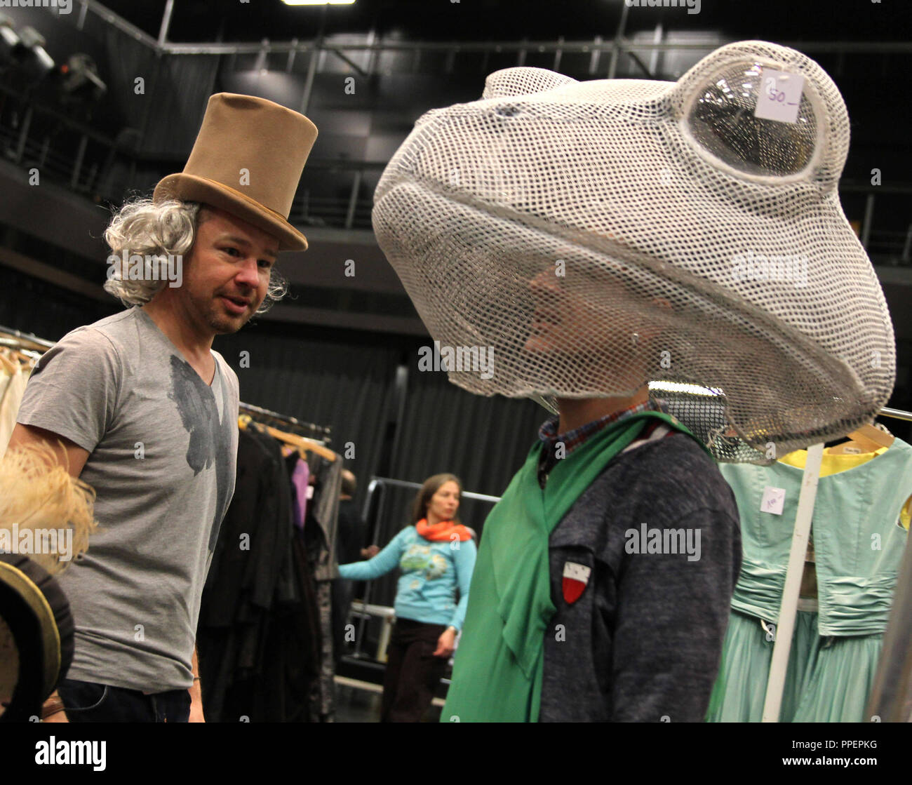 Man in a frog mask at the costume sale of the Bavarian State Opera ...