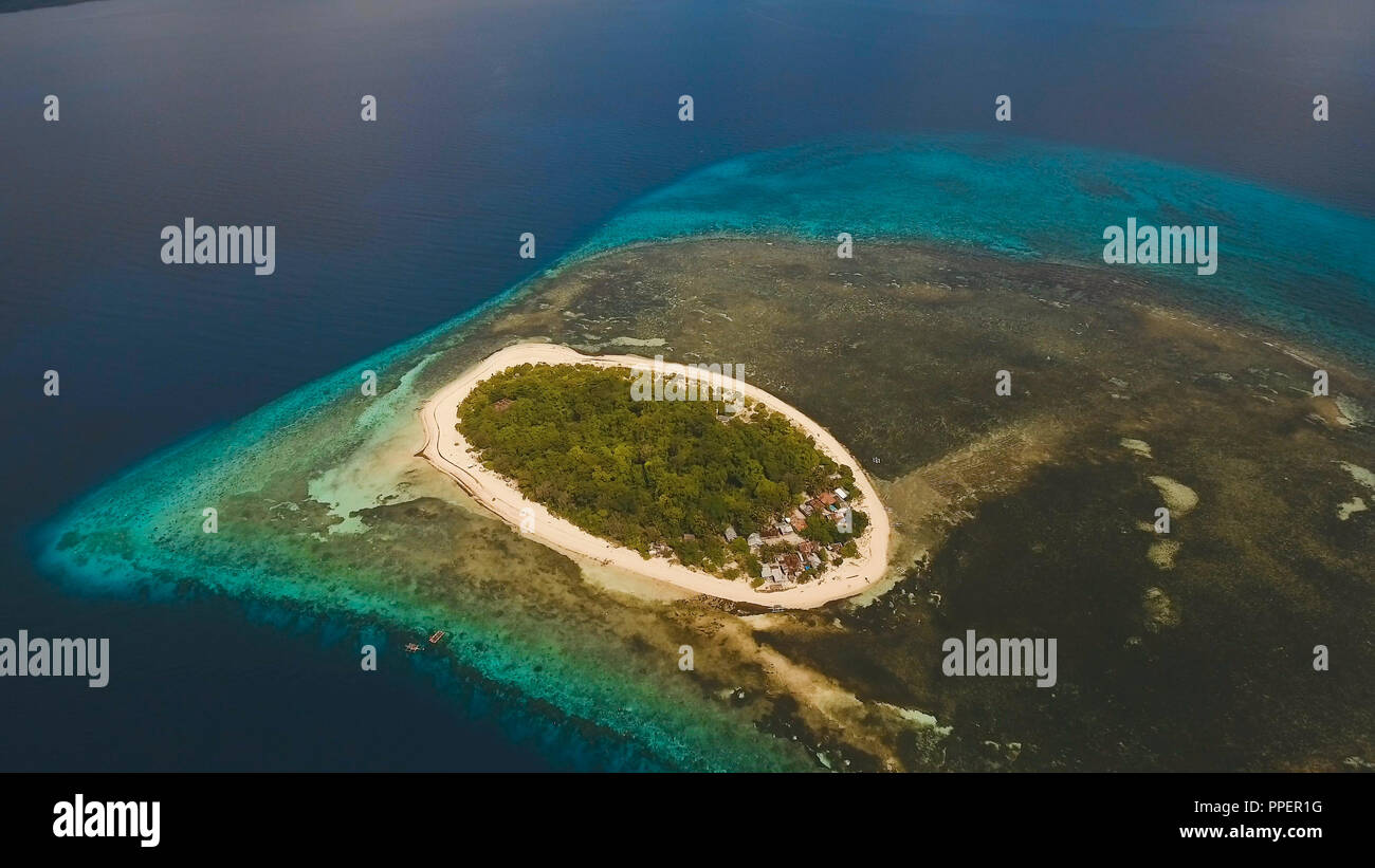 Aerial view of beautiful tropical island Mantigue with white sand beach ...