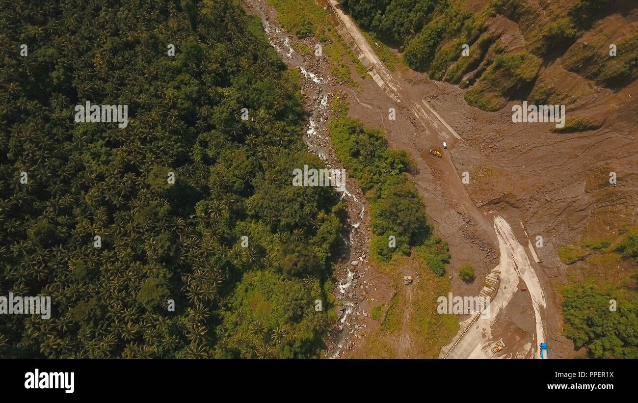 Landslides and rockfalls on the road in the mountains, Camiguin. Aerial ...