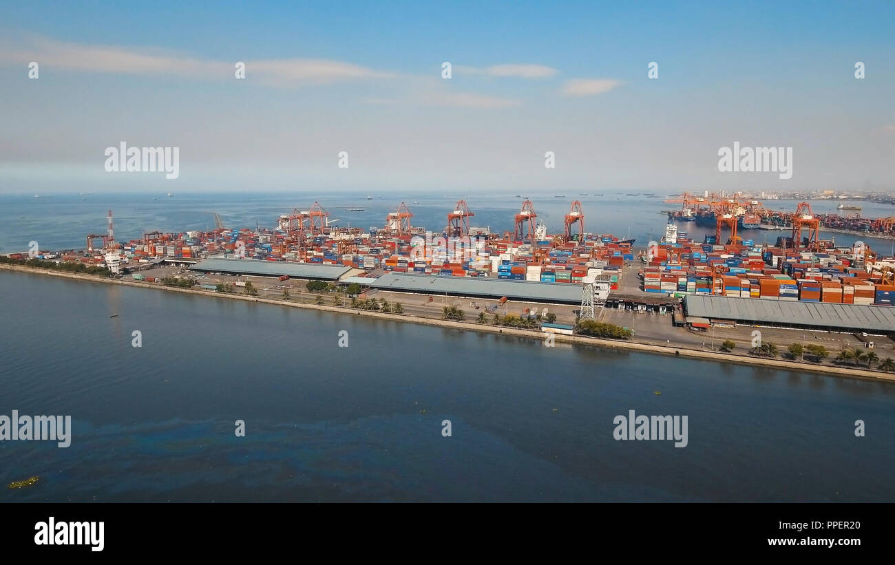 Aerial view industrial cargo port with ships and cranes, Manila. View ...
