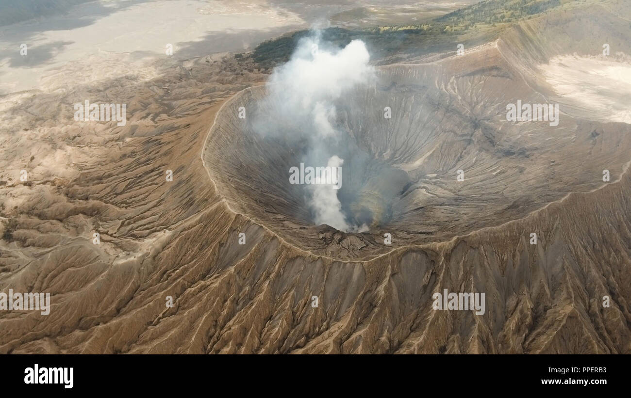 Crater with active volcano smoke in East Jawa, Indonesia. Aerial view ...
