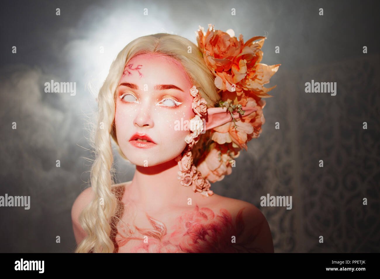 Young beautiful girl elf. Creative make-up and bodyart Hairstyle with ...