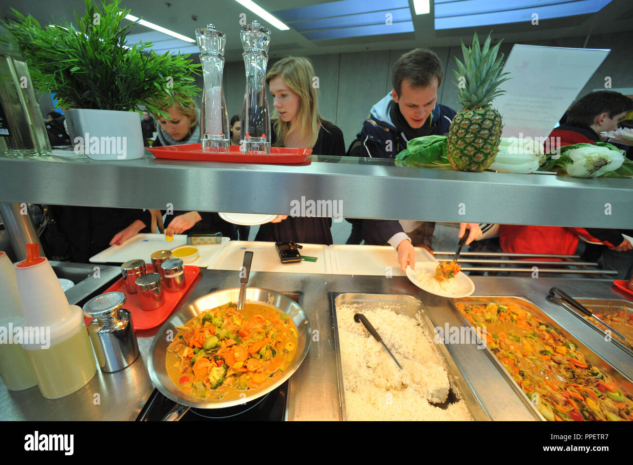 Students at a front cooking station with self-service in the renovated ...