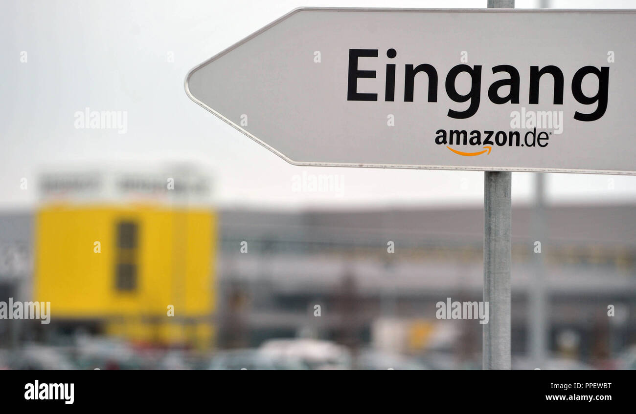 Sign showing the way to the entrance of the large logistics center of ...