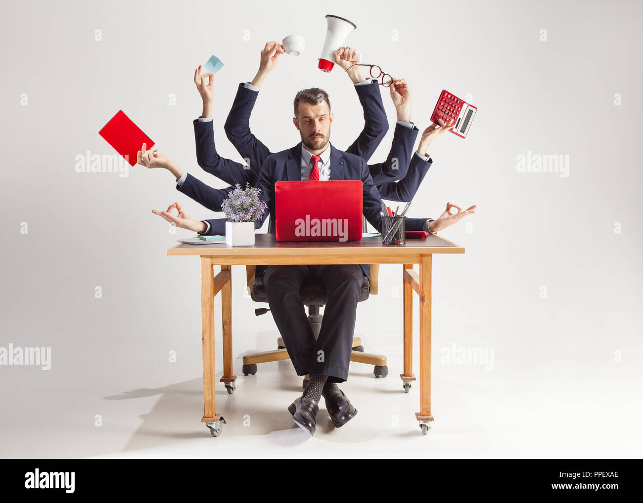 businessman with many hands in elegant suit working and holding office ...