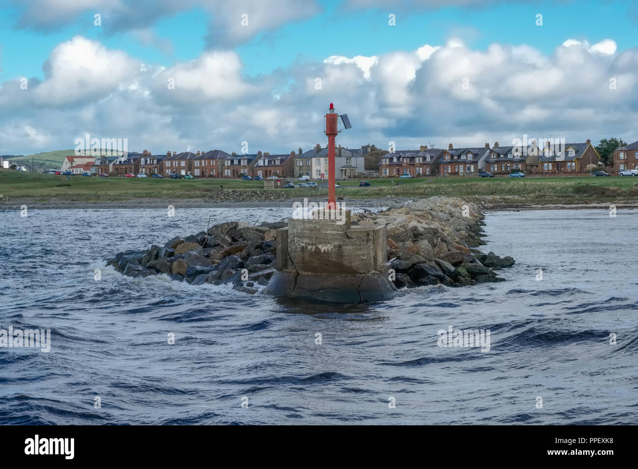 Looking along the inner Girvan sea defence wall to the residential area ...