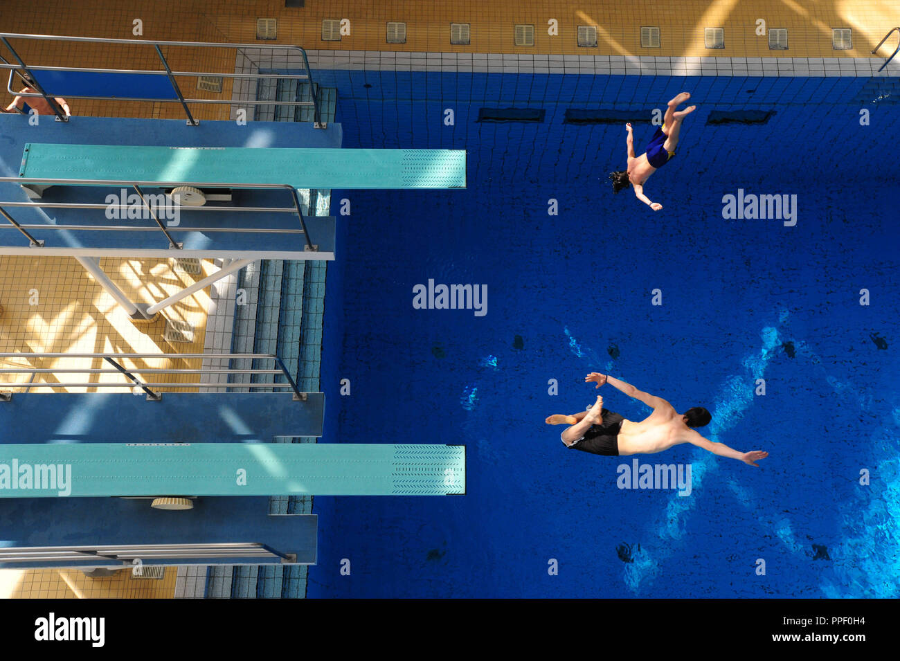 Indoor swimming pool with diving board hi-res stock photography and ...