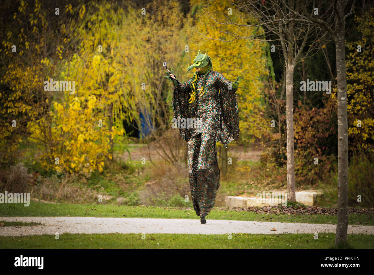Roland Muehlbauer is filmed in his stilt-dragon costume in Munich's ...